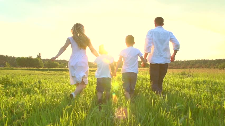 Happy Young Family With Two Children Running On Summer Field. Healthy ...