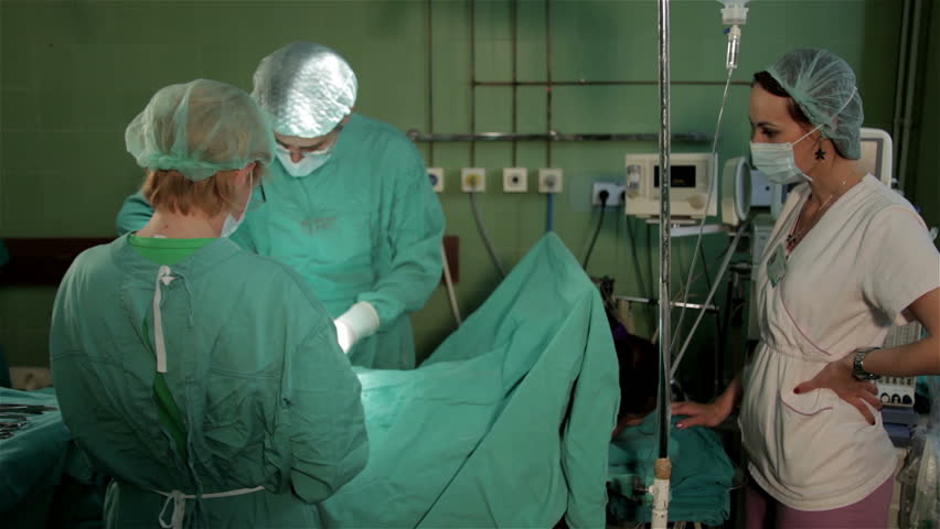 Surgeons Using Scalpel, Making Surgical Cut, Surgical Operation ...
