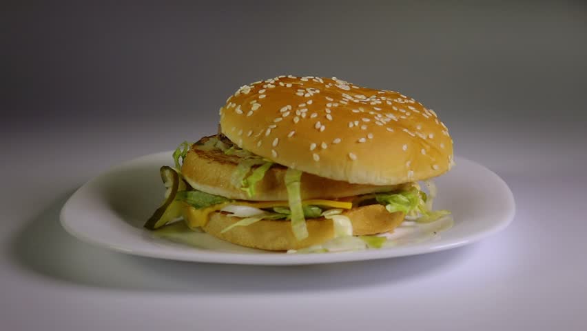 Fried Potato Chips Falling Down On Hamburger, Slow Motion, Fast Food ...
