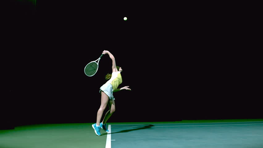 Female Tennis Player Serving In Slow Motion - Wide Shot Of Court With ...