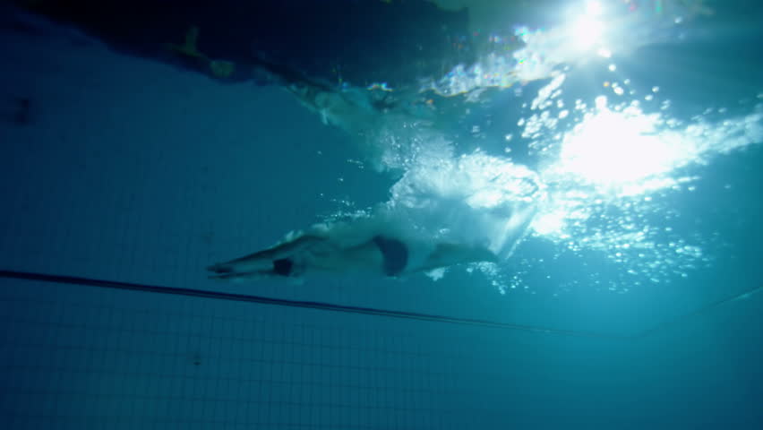 Underwater View Of A Professional Male Swimmer Diving Into Deep Blue ...