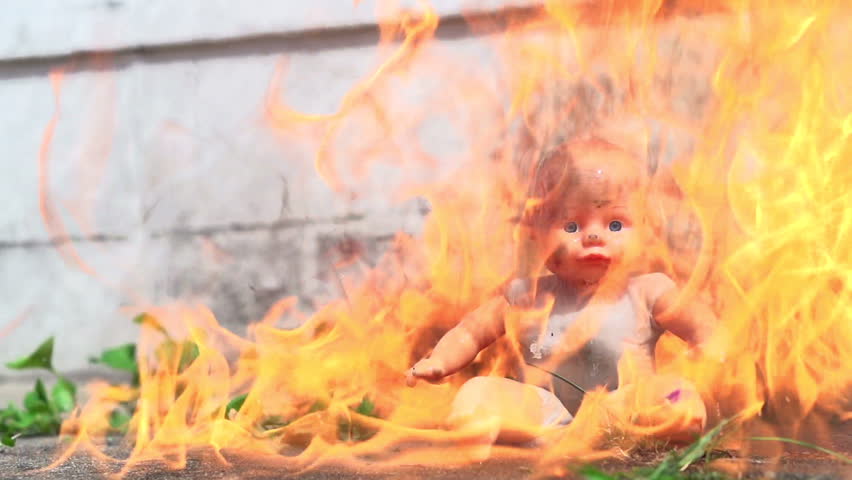 Small Baby Doll Sitting In Flame Stock Footage Video 4676087 - Shutterstock