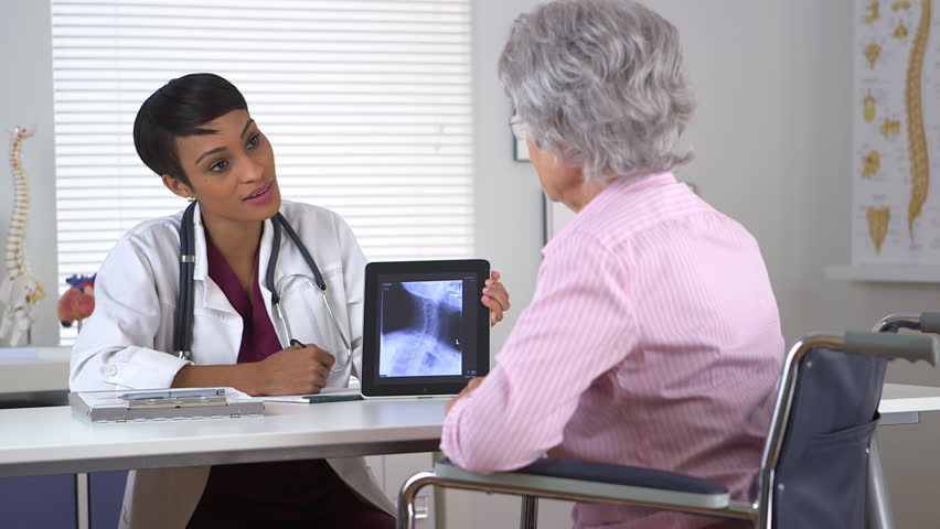 Doctor Explaining Brain Scans To Elderly Woman Stock Footage Video ...