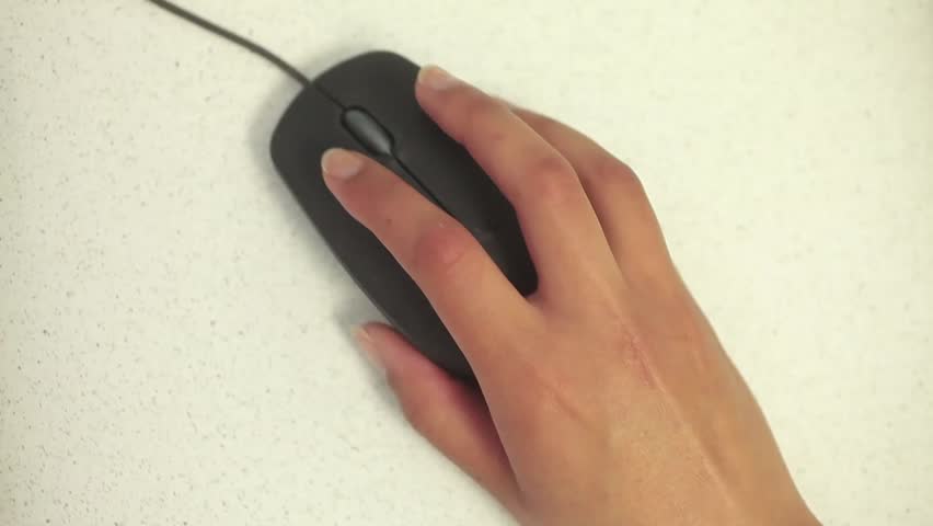 Hand Holding And Moving A Computer Mouse Against A White Background ...