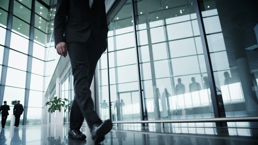 Attractive And Confident Businessman Is Walking Around A Light And ...